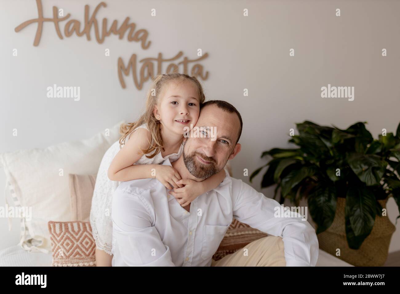 Portrait of happy father head to head with his daughter at home Stock ...