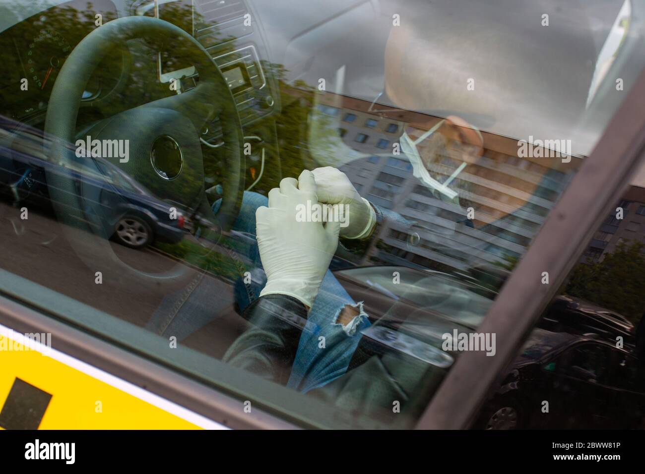 Taxi driver in gloves hi-res stock photography and images - Alamy