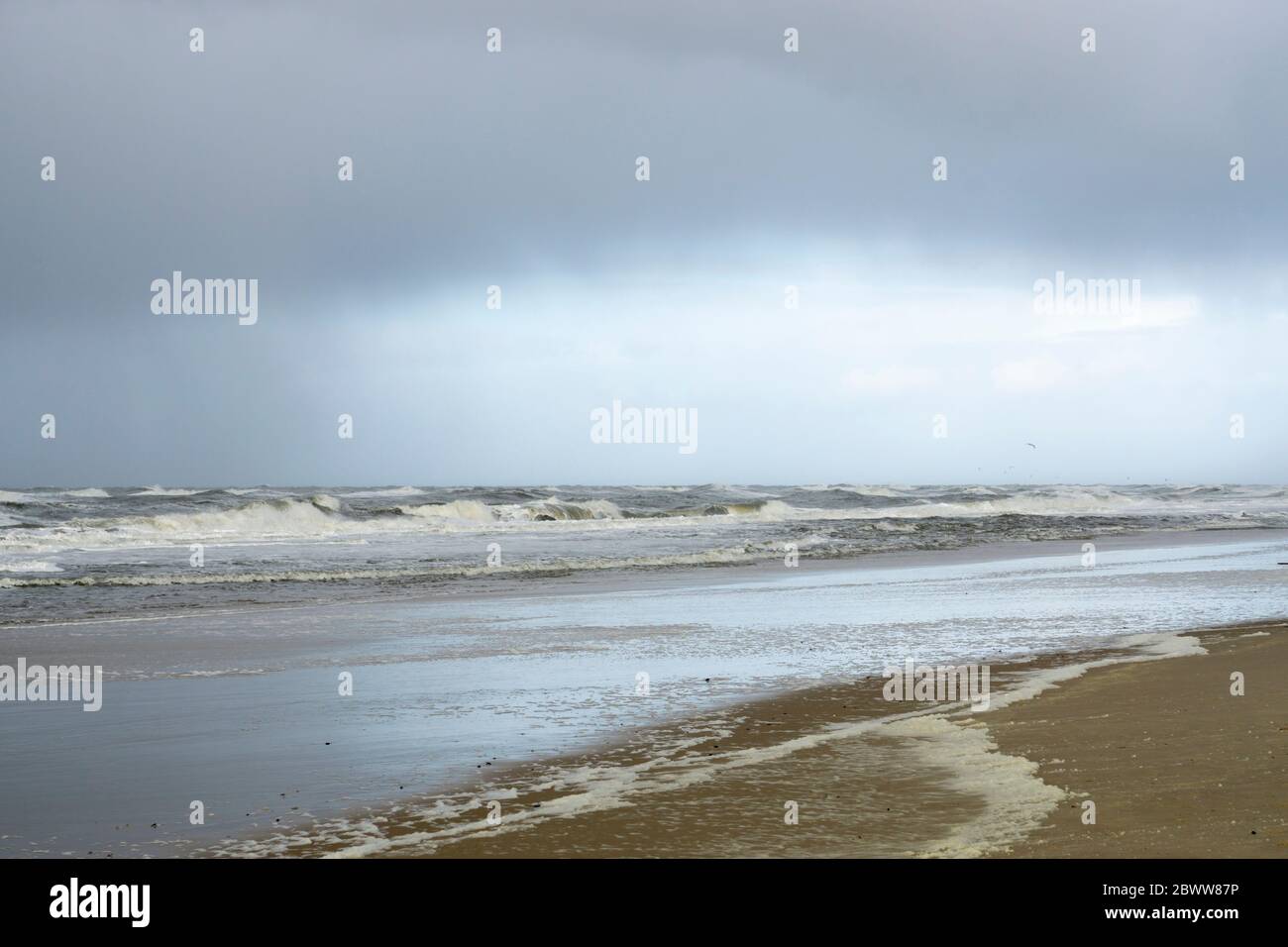 Germany, Schleswig-Holstein, Westerland, Clouds over coastal beach of ...