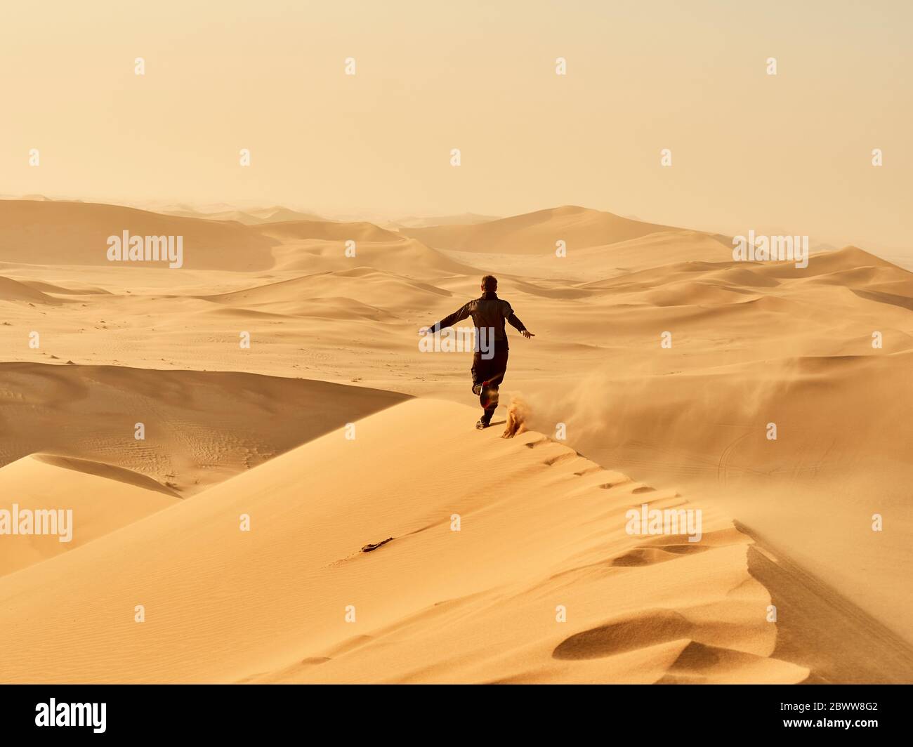 Man running on a dune in the desert, Dune 7, Walvis Bay, Namibia Stock Photo - Alamy