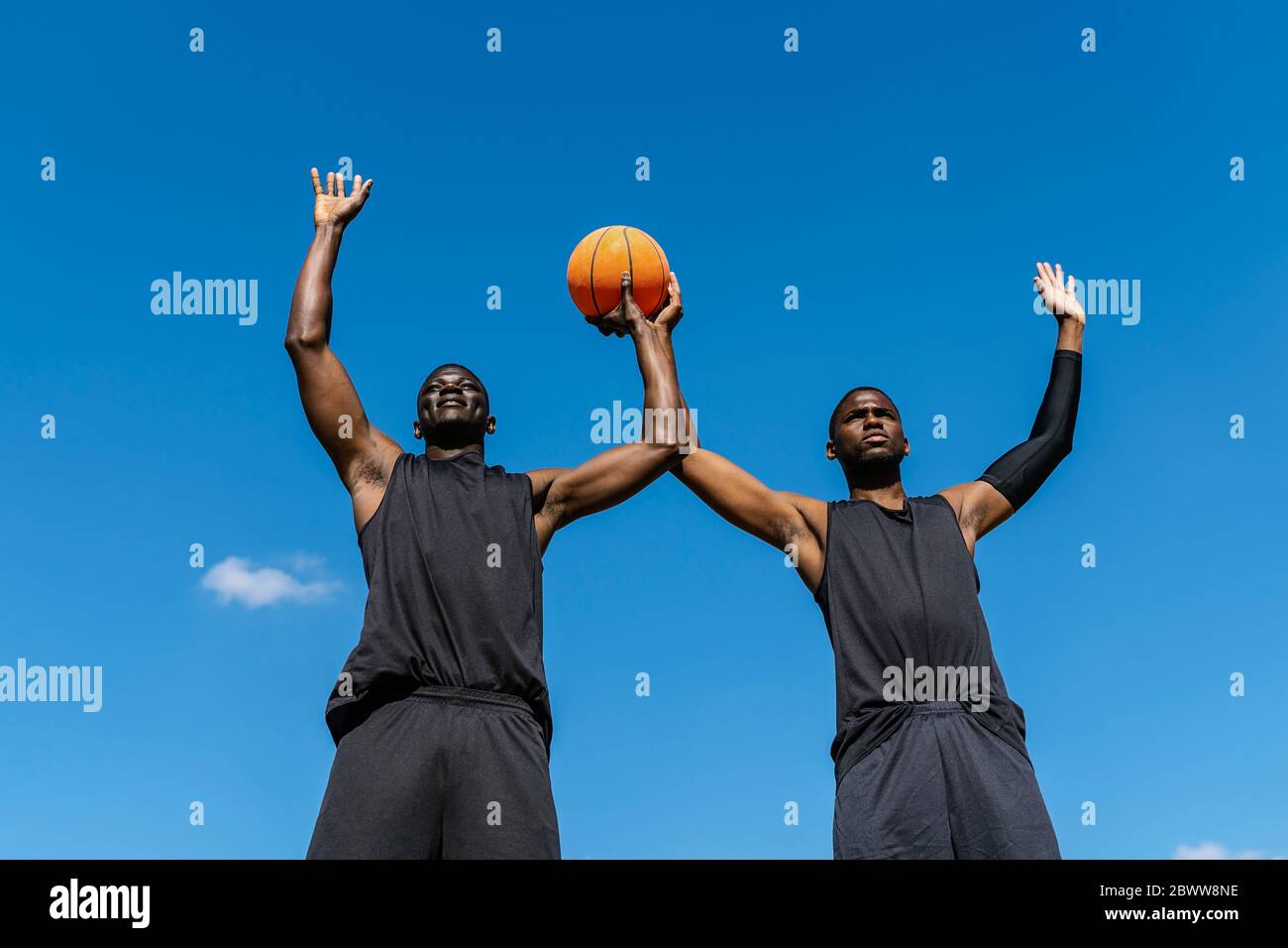 Basketball player raising arms hi-res stock photography and images - Alamy