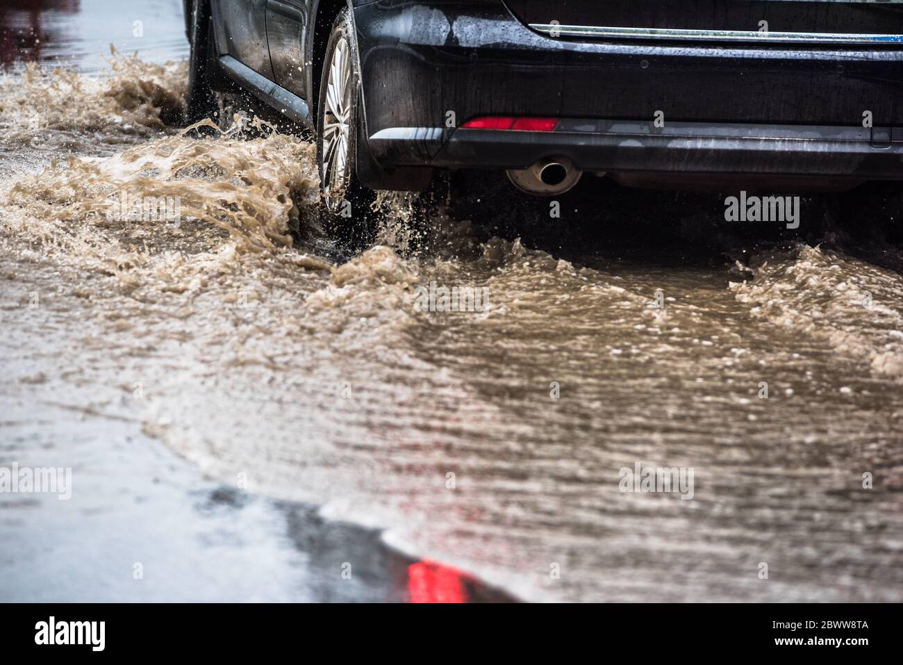 dirty water splash after vehicle roaring by Stock Photo - Alamy