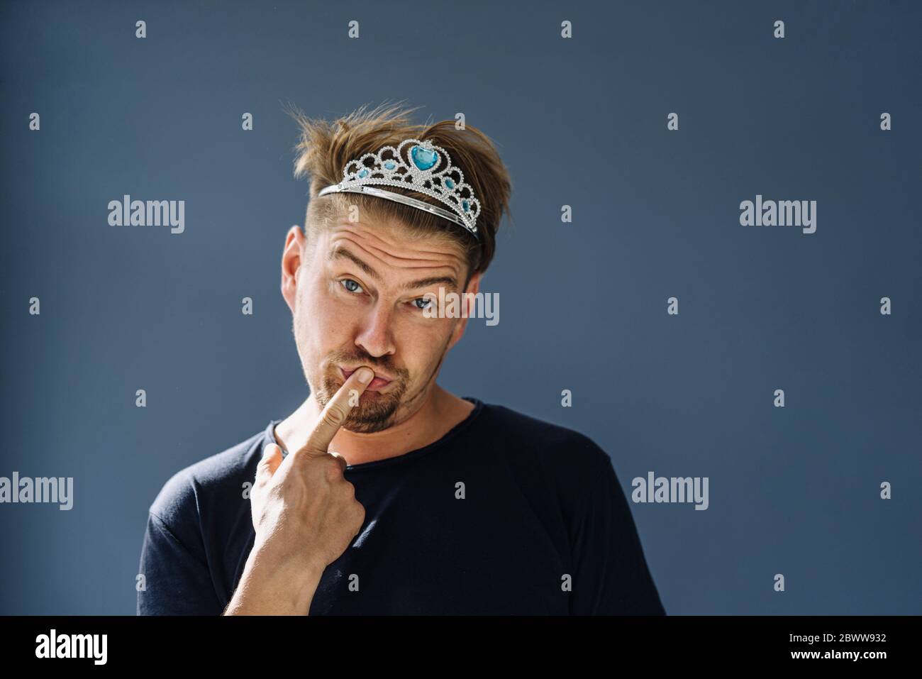 Portrait of a bearded man wearing a tiara Stock Photo - Alamy