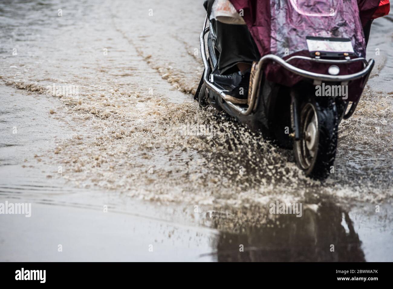 dirty water splash after vehicle roaring by Stock Photo - Alamy