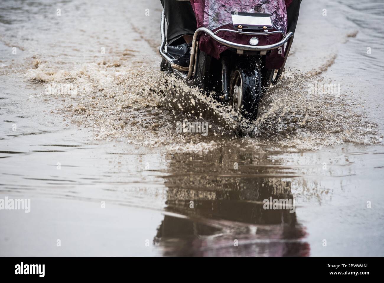dirty water splash after vehicle roaring by Stock Photo - Alamy