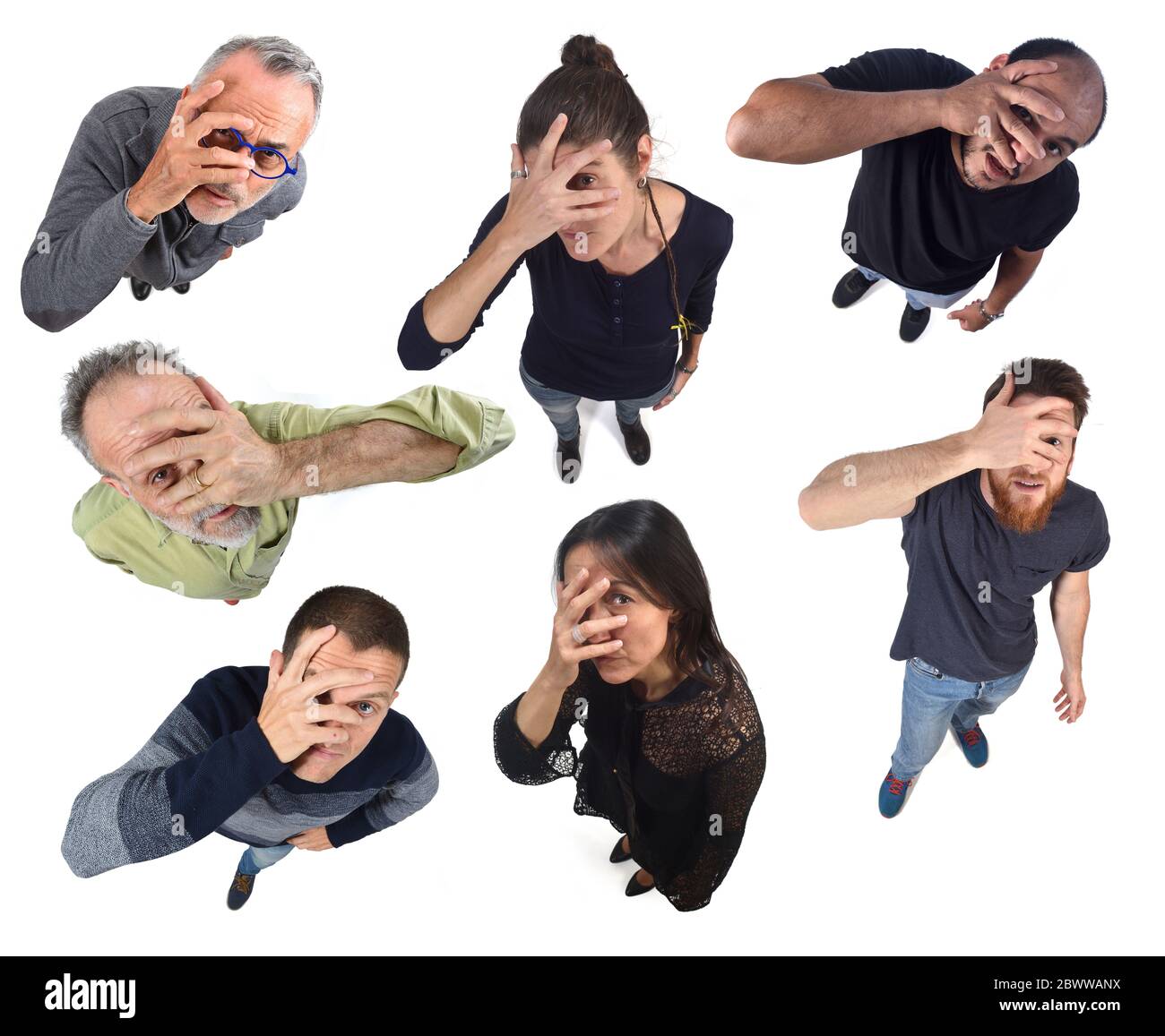 group of people peeking with hand on face on white background Stock ...