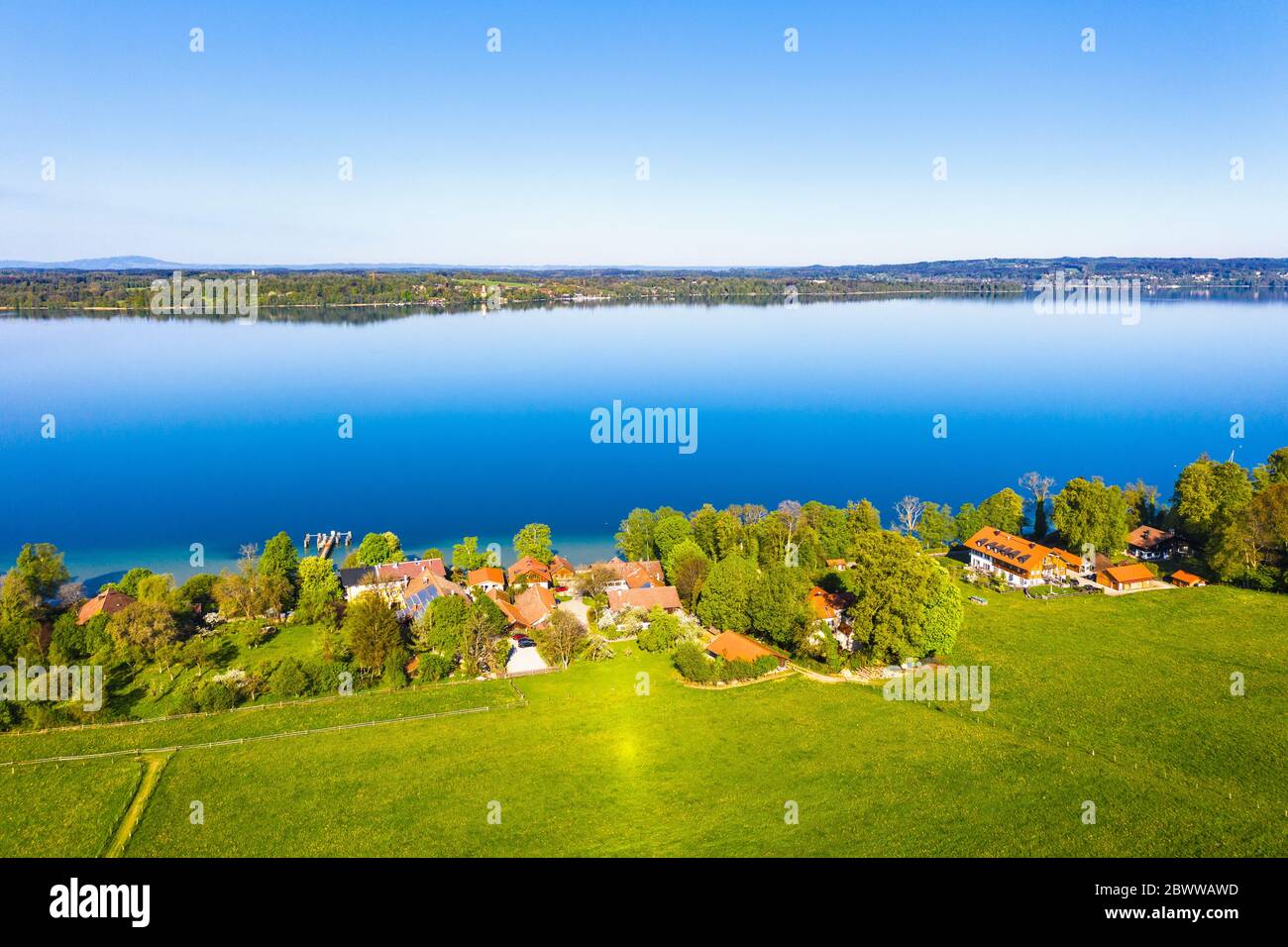 Germany, Bavaria, Munsing, Drone view of village at shore of Lake Starnberg in spring Stock ...