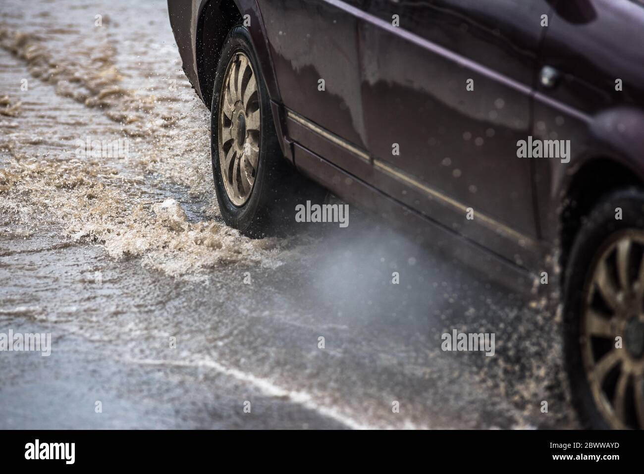 dirty water splash after vehicle roaring by Stock Photo - Alamy