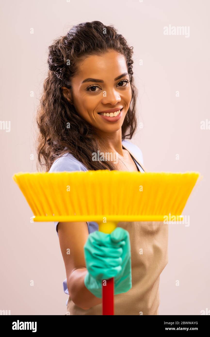 Portrait of happy and successful african-american professional maid ...