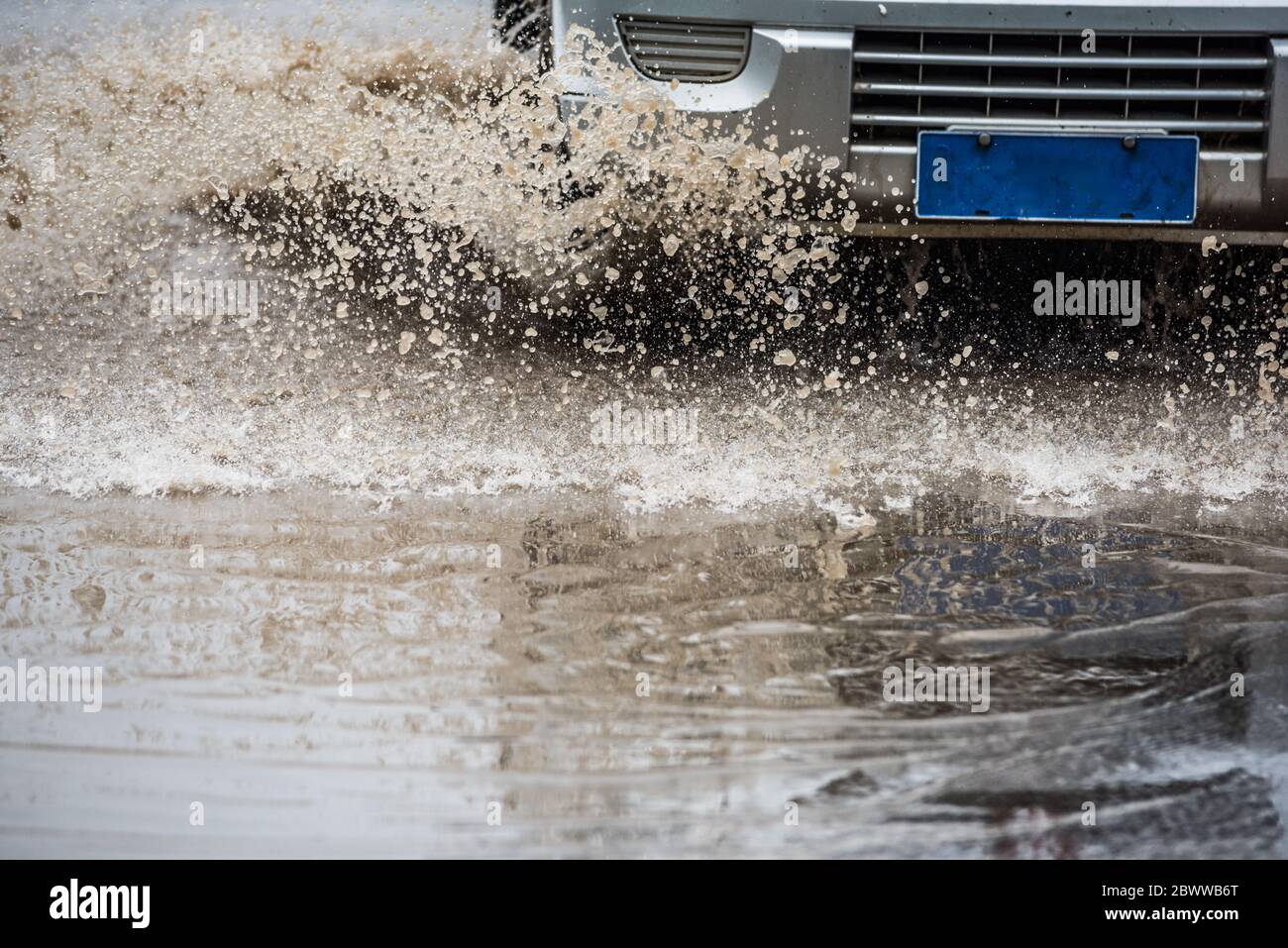 dirty water splash after vehicle roaring by Stock Photo - Alamy