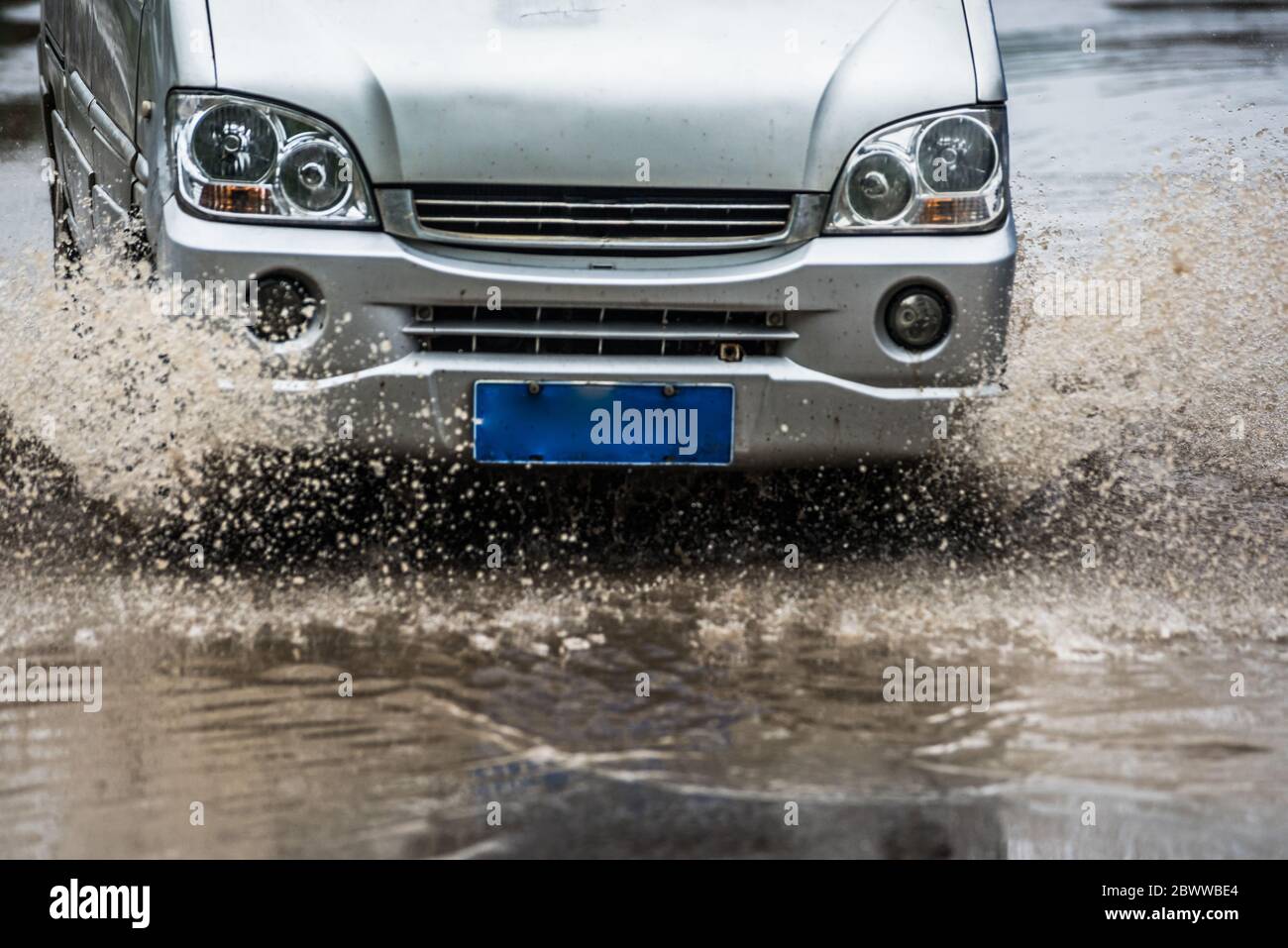 dirty water splash after vehicle roaring by Stock Photo - Alamy
