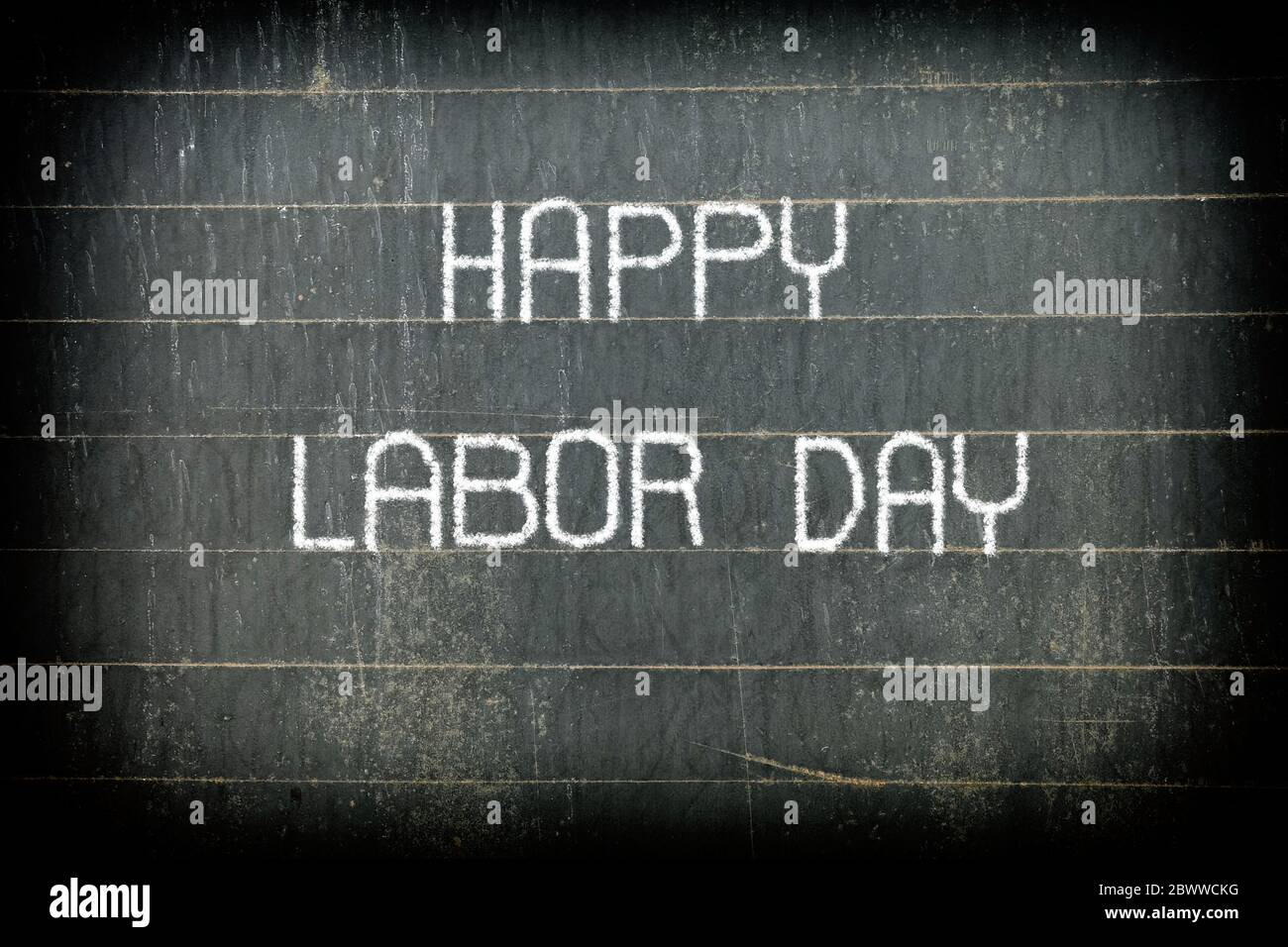 Happy Labor Day Chalking Writing on Blackboard Stock Photo - Alamy