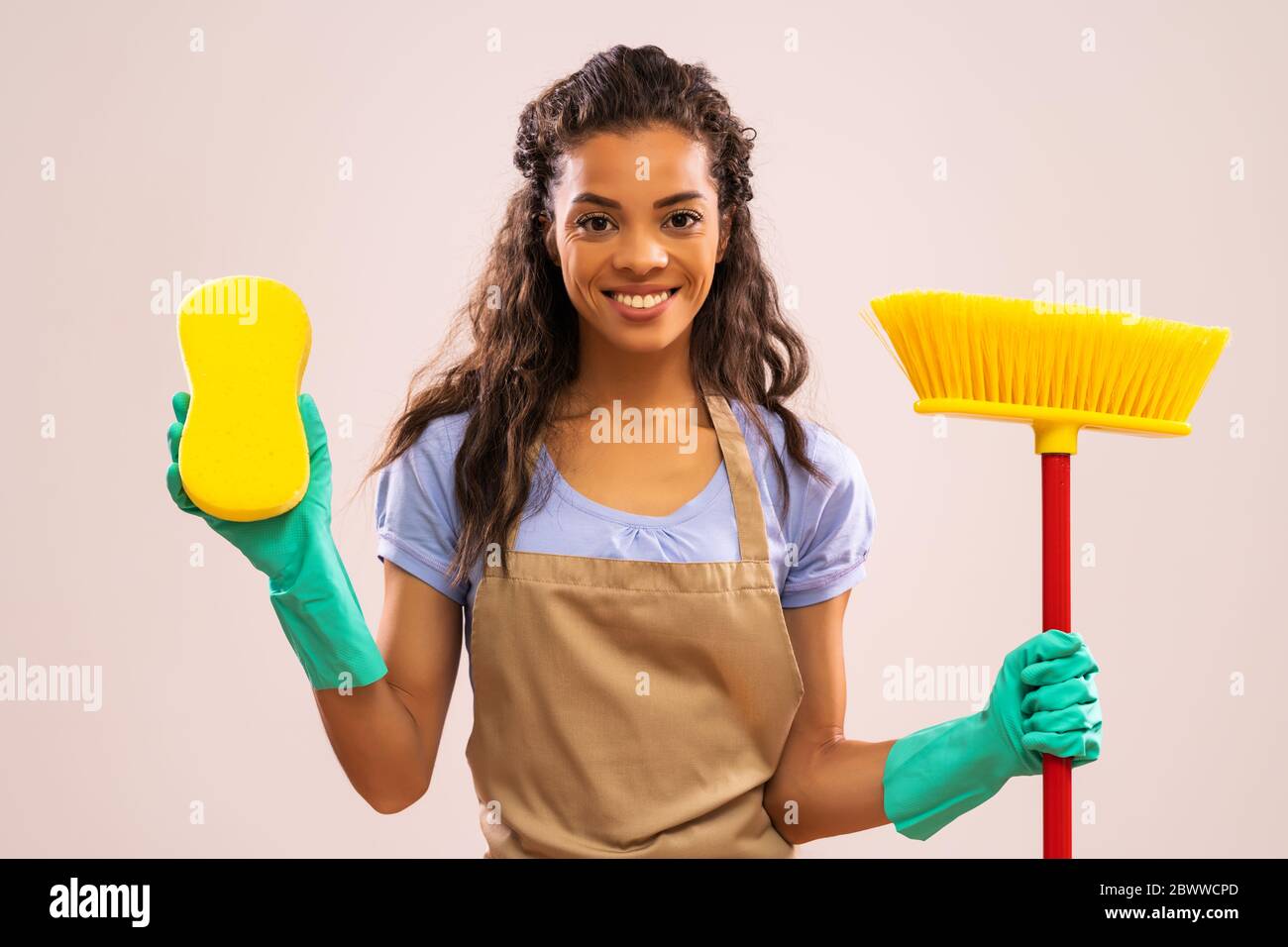 Portrait of happy and successful african-american professional maid ...