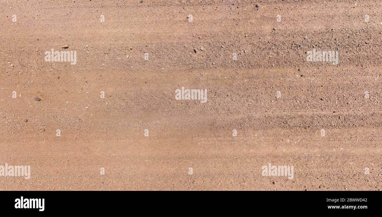 view from above on texture of gravel road with car tire tracks Stock ...