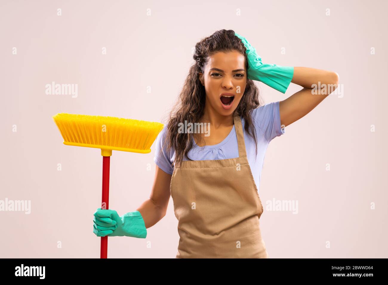 Portrait Of African American Housewife Who Doesnt Like Cleaning Stock