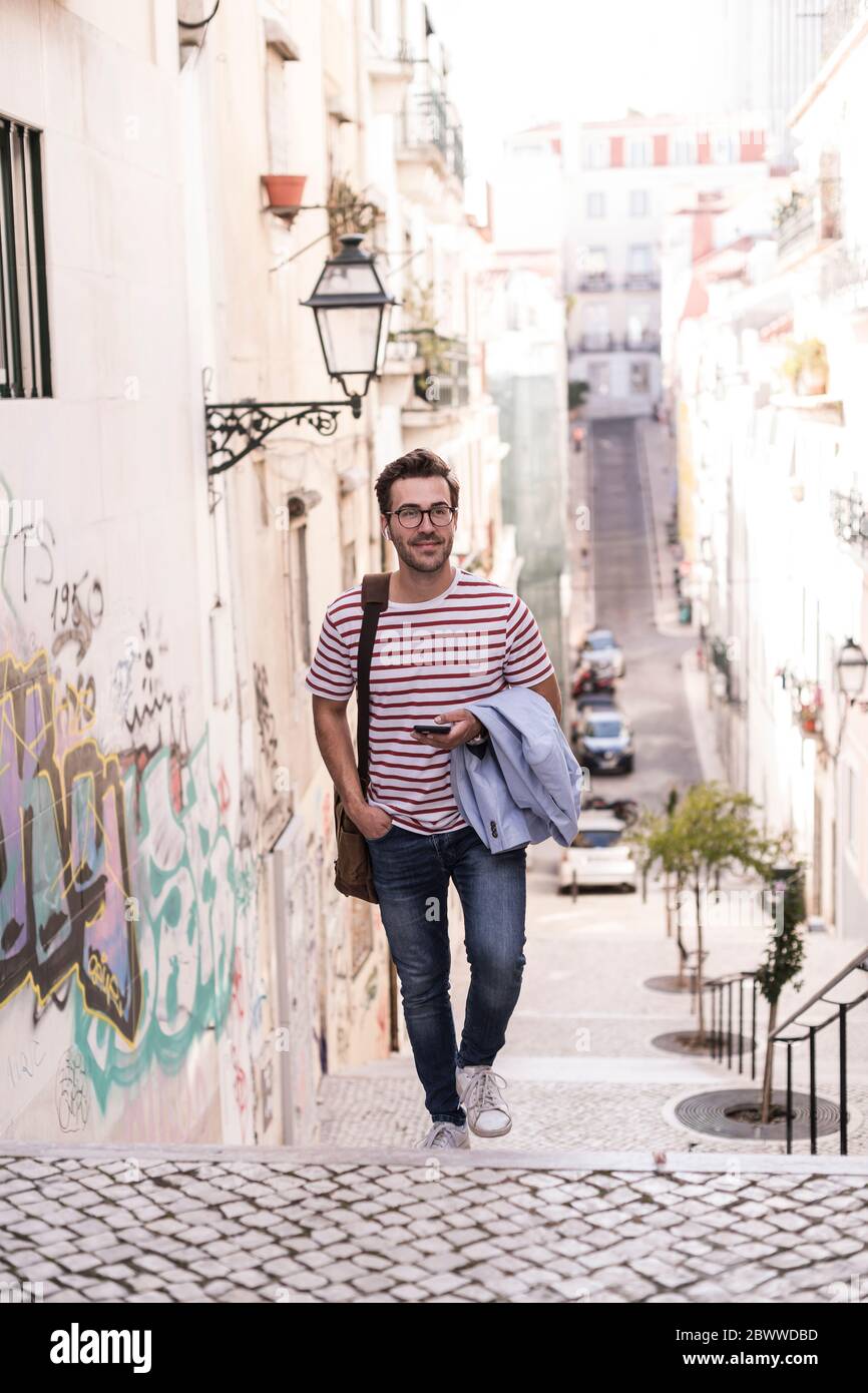Man walking up stairs hi-res stock photography and images - Alamy