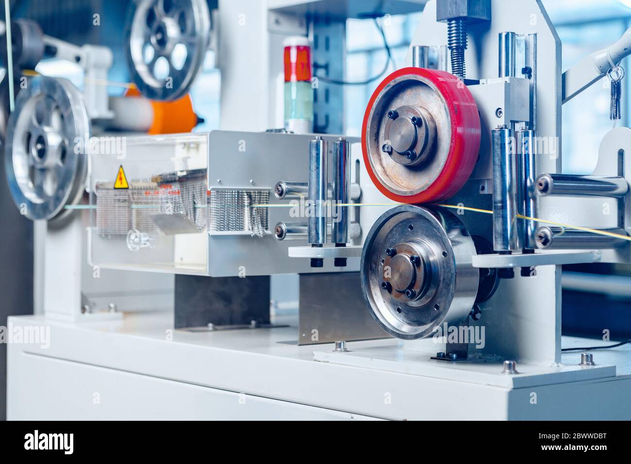 Inside a modern plant producing power electric cables and optical ...