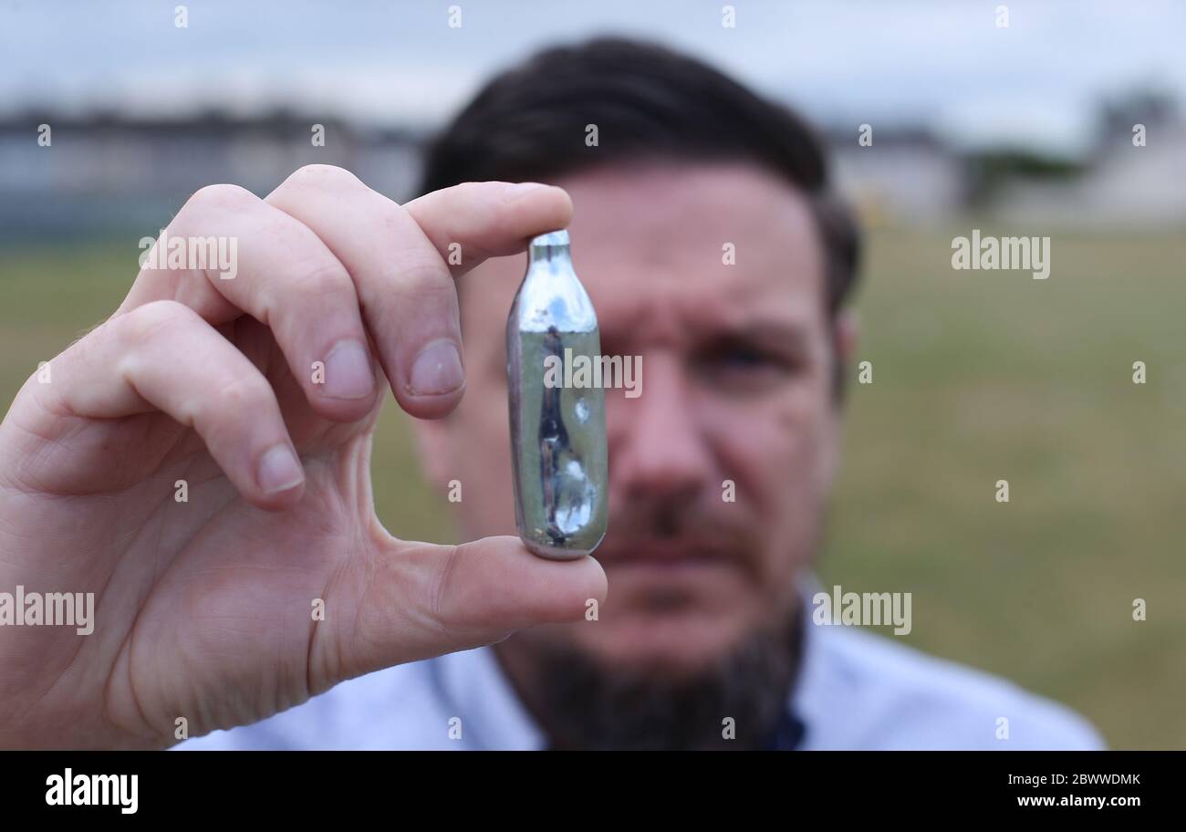 Sinn Fein TD Mark Ward holds canisters of nitrous oxide or 'hippie ...