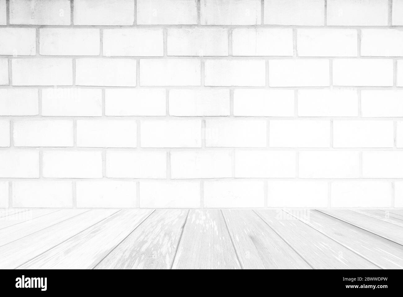 White Wood Table with Brick Wall Background Stock Photo - Alamy
