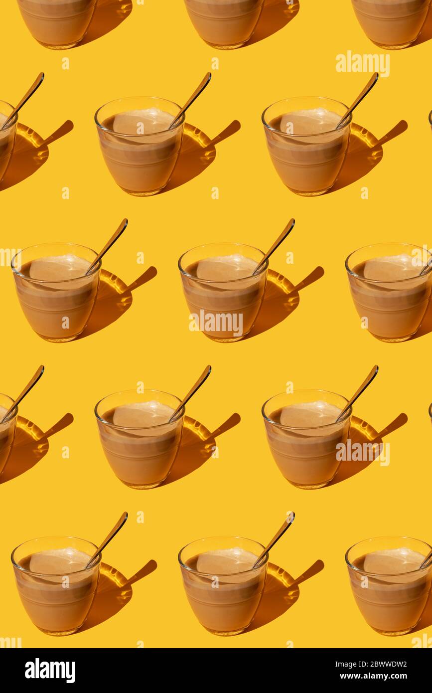 Pattern of vintage cups of latte against yellow background Stock Photo ...