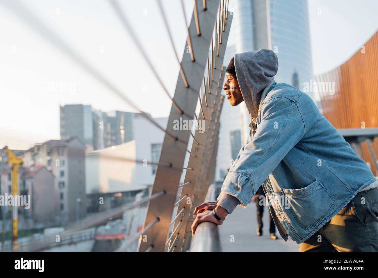 Man standing bridge sunset hi-res stock photography and images - Alamy