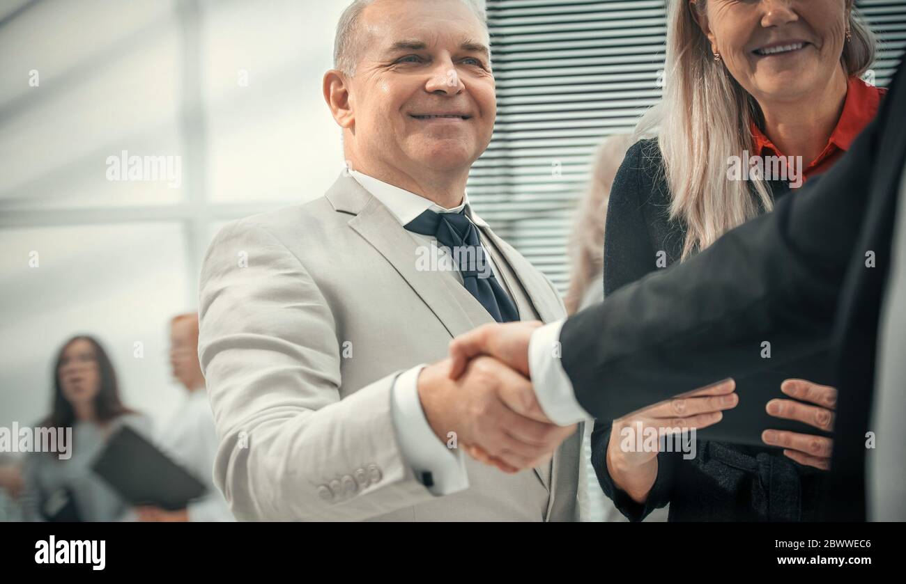 close up. handshake of business people in a modern office Stock Photo ...