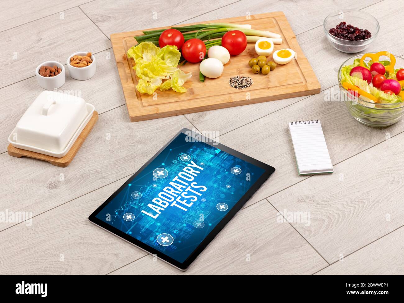 LABORATORY TESTS concept in tablet pc with healthy food around, top ...