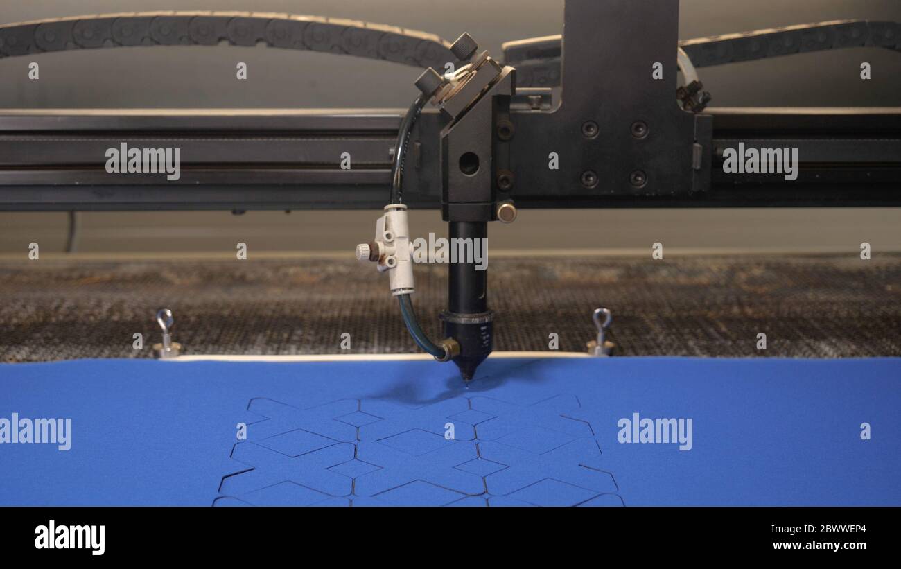 Industrial garment factory, an automatic sewing machine sews various ...