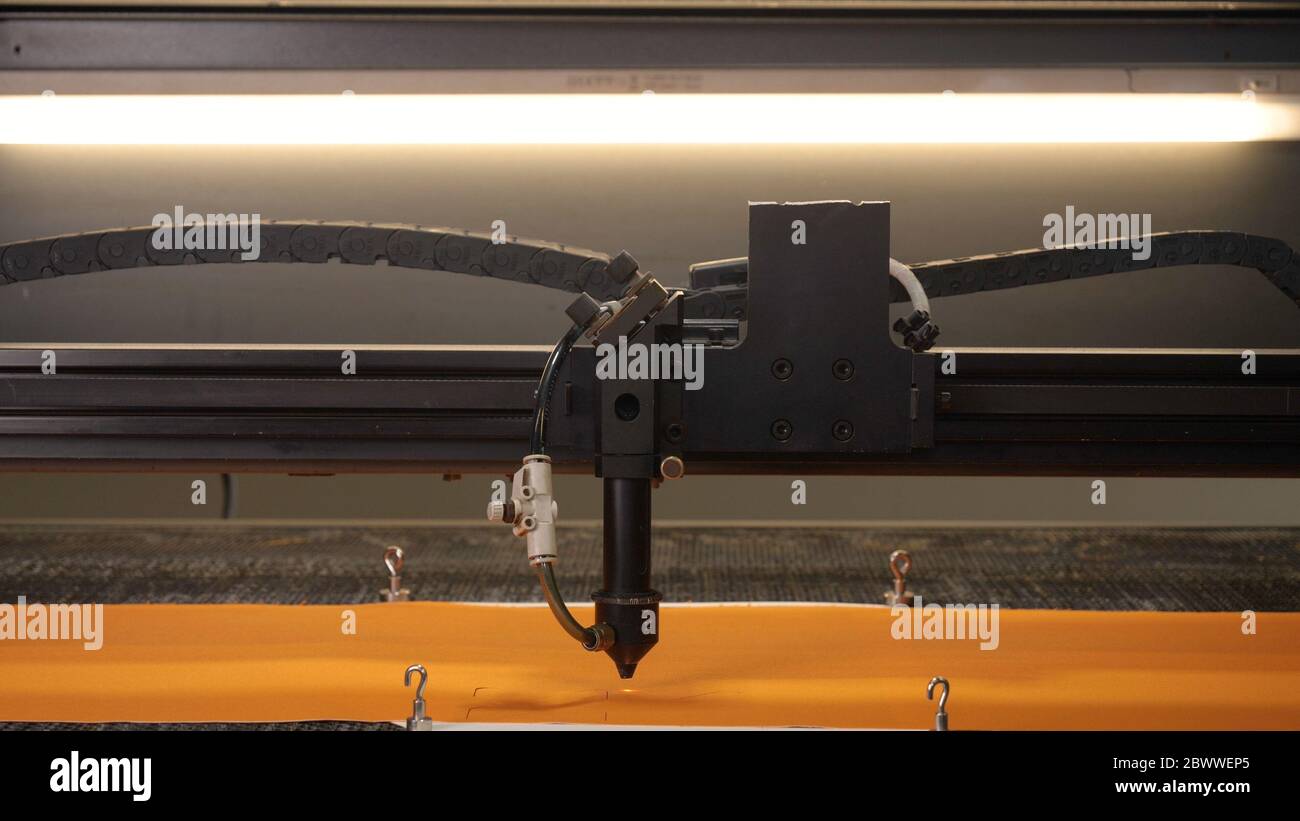 Industrial garment factory, an automatic sewing machine sews various ...