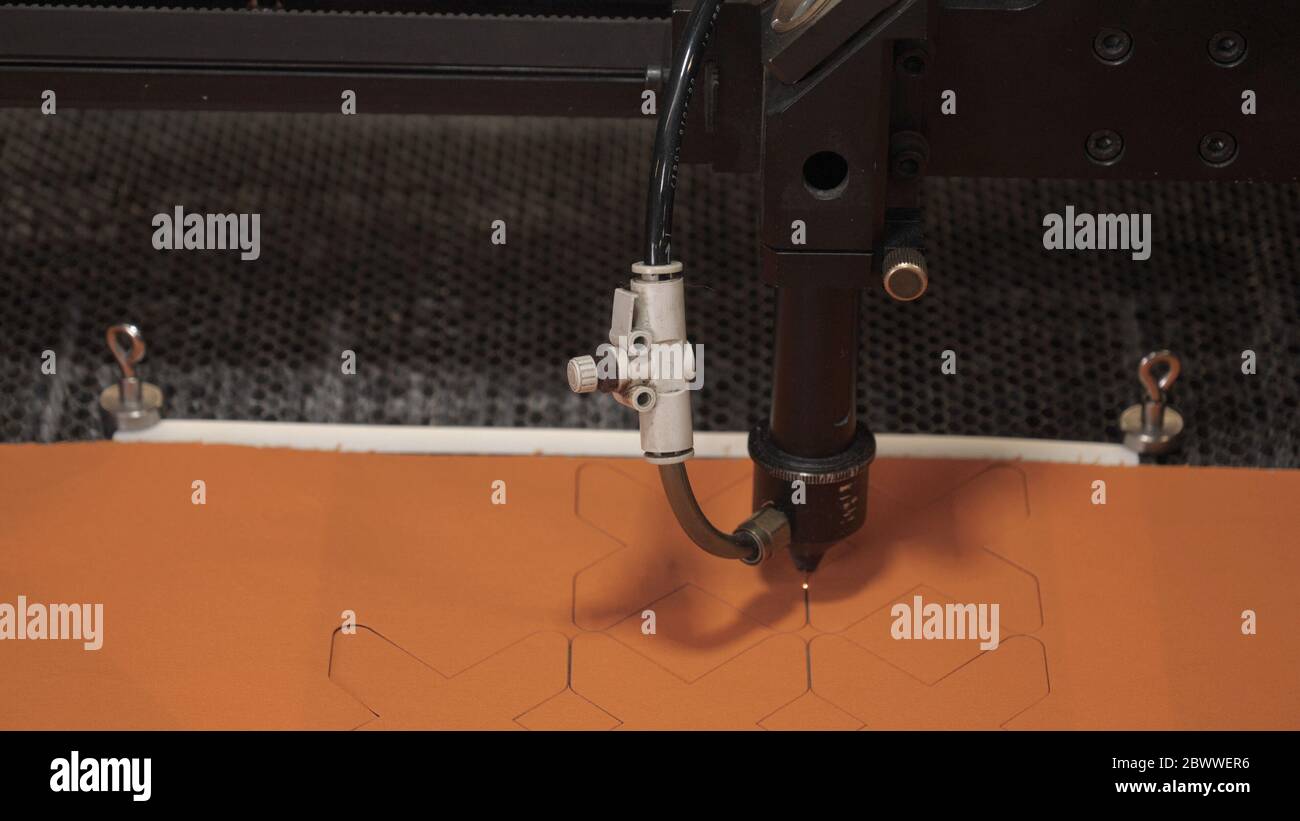 Industrial garment factory, an automatic sewing machine sews various ...