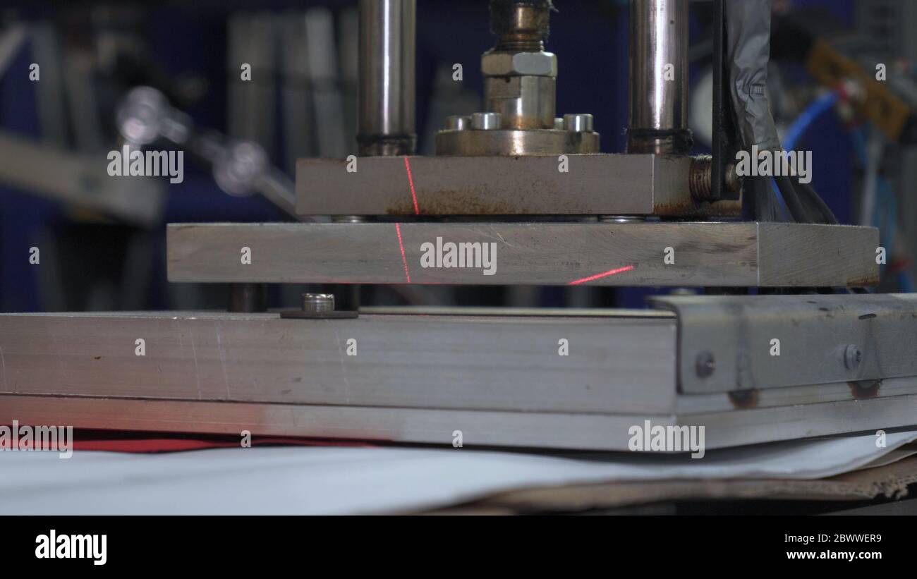 Industrial garment factory, an automatic sewing machine sews various ...