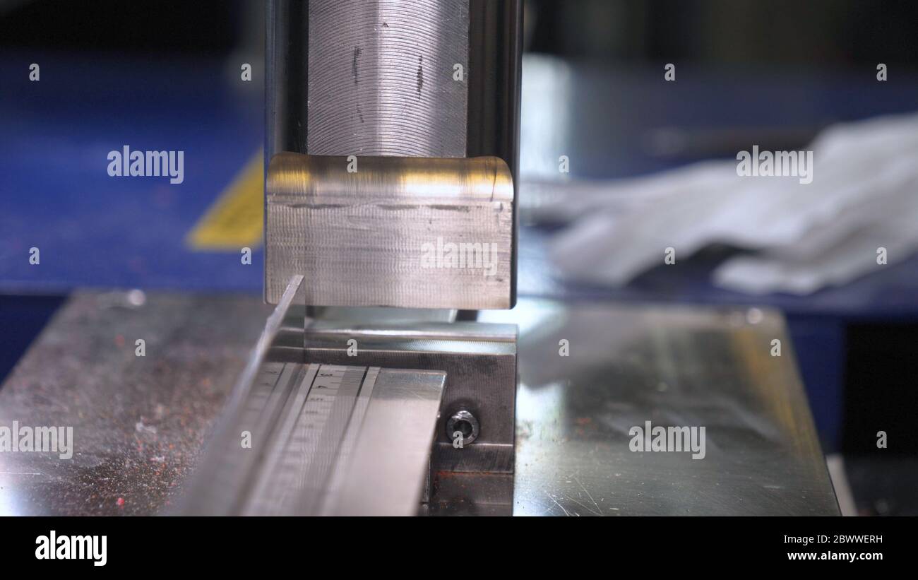 Industrial garment factory, an automatic sewing machine sews various ...