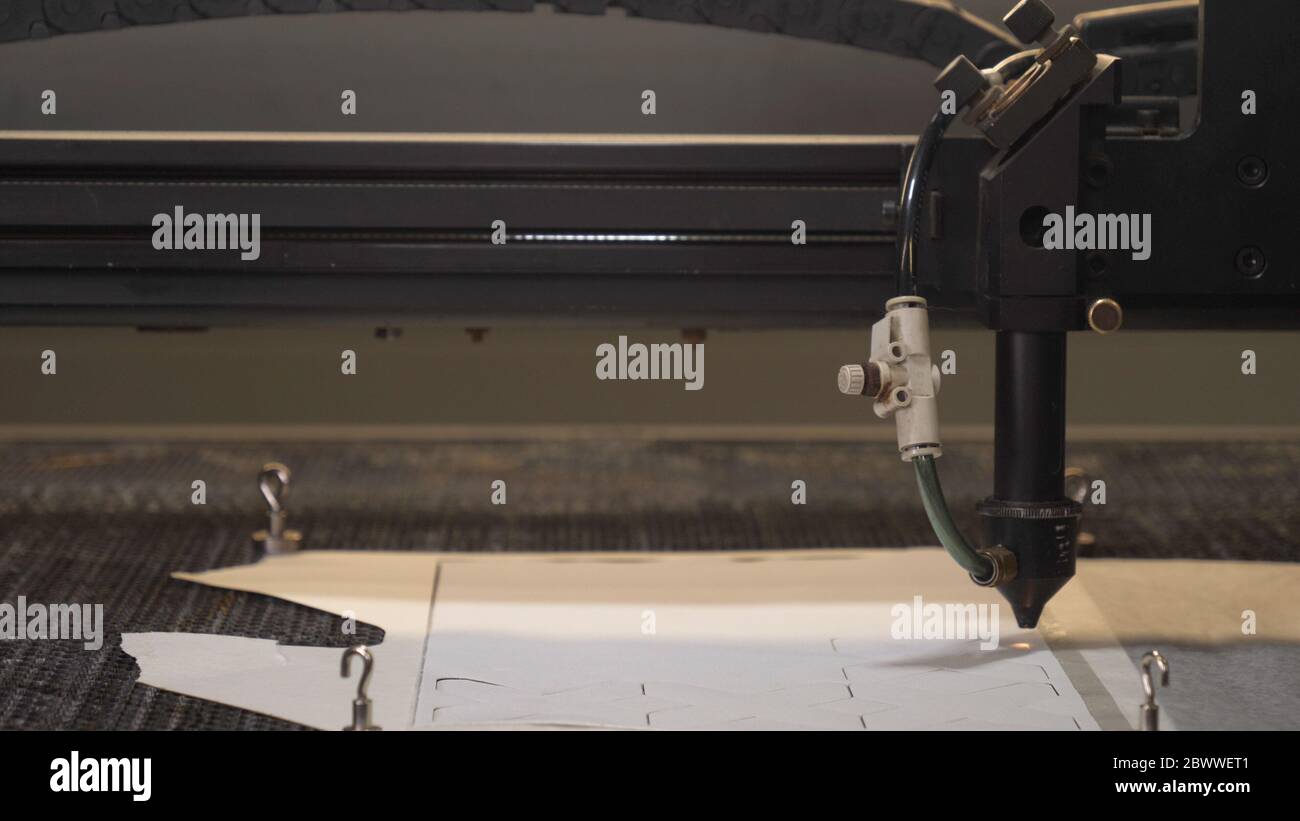 Industrial garment factory, an automatic sewing machine sews various ...