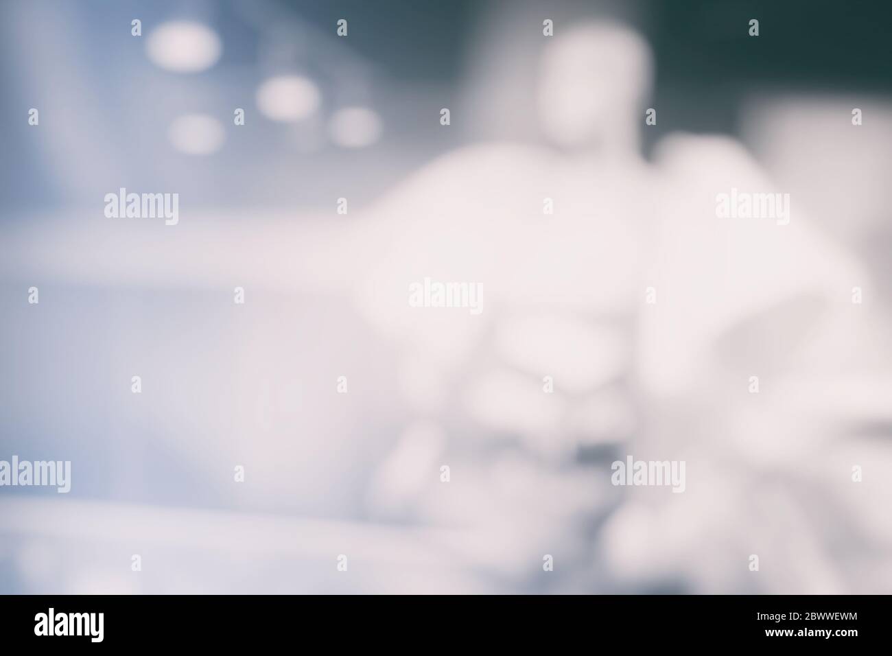 White Blurred Clothing Showcase Store Background Stock Photo - Alamy