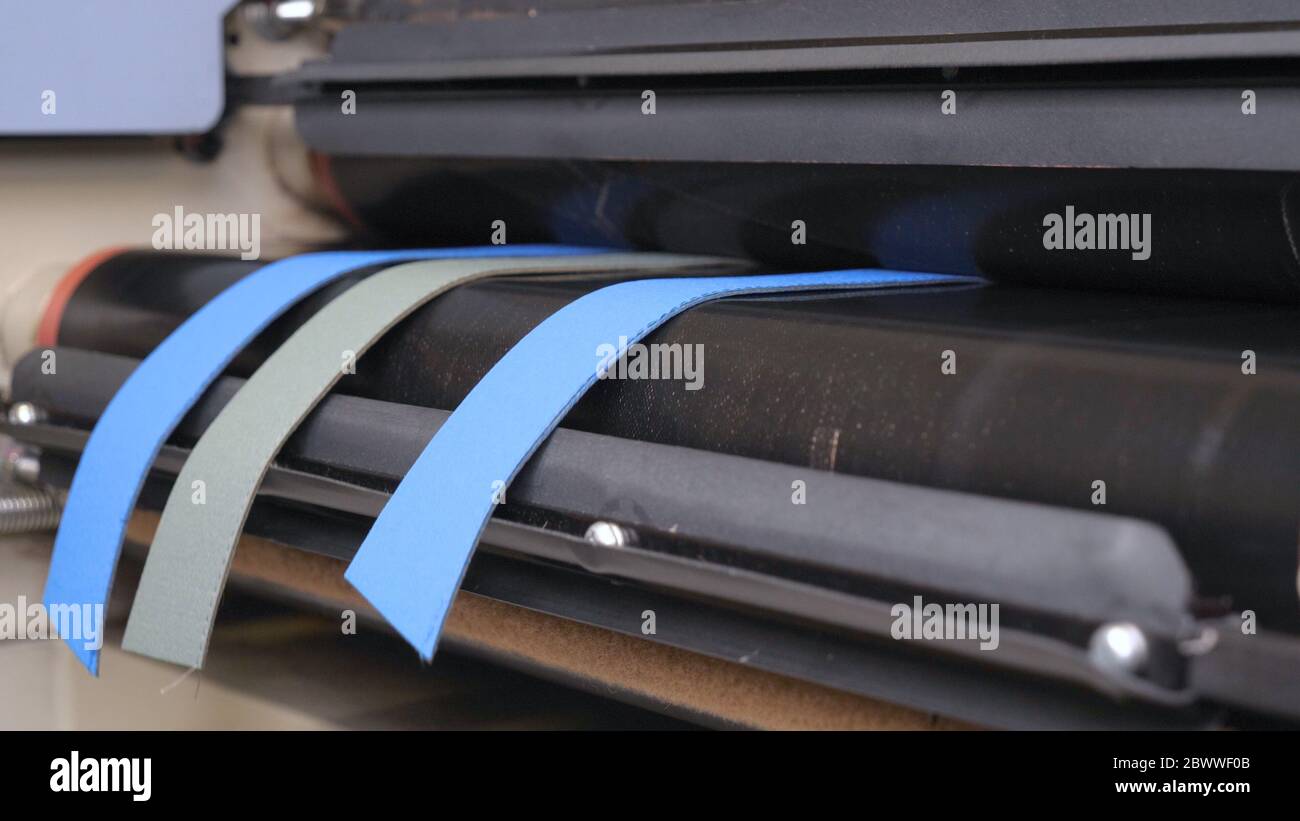 Industrial garment factory, an automatic sewing machine sews various ...