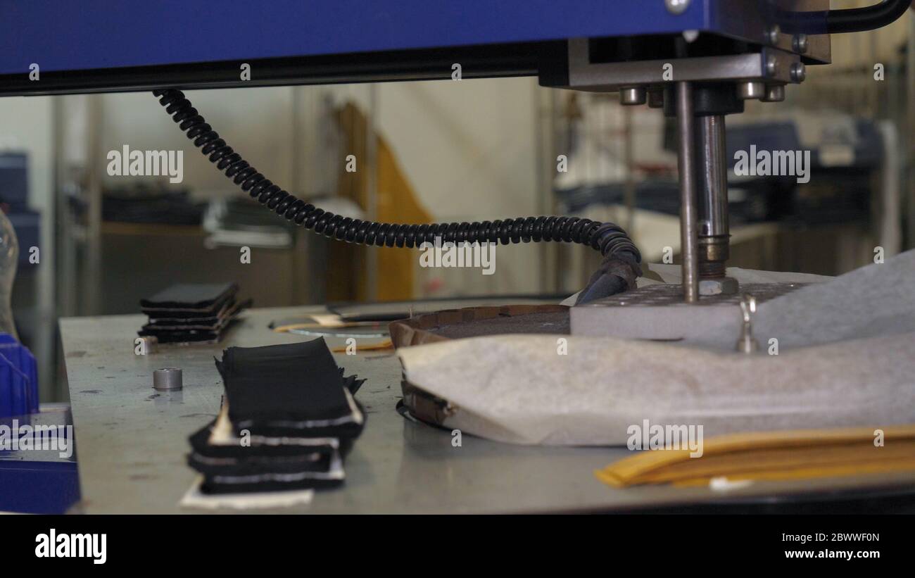 Industrial garment factory, an automatic sewing machine sews various ...