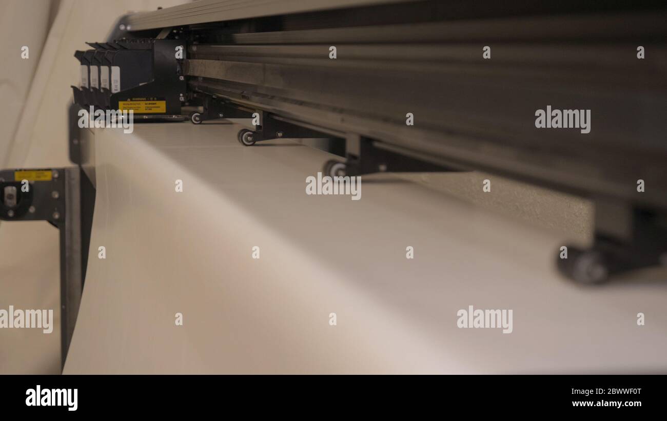 Industrial garment factory, an automatic sewing machine sews various ...