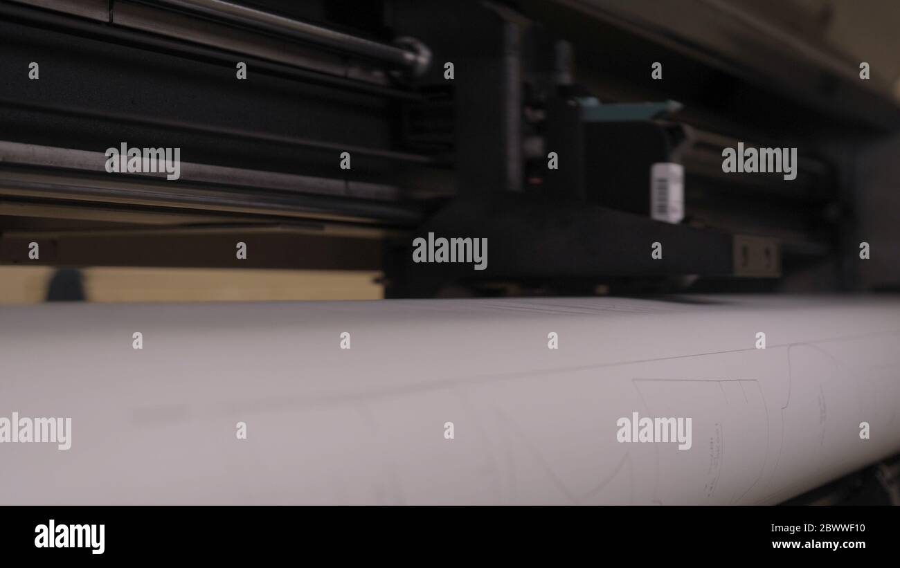 Industrial garment factory, an automatic sewing machine sews various ...