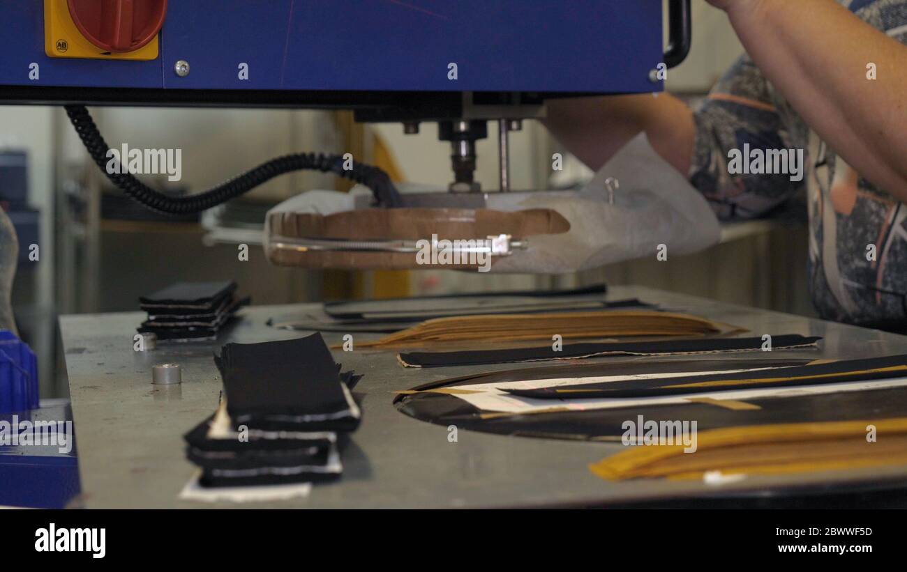 Industrial garment factory, an automatic sewing machine sews various ...