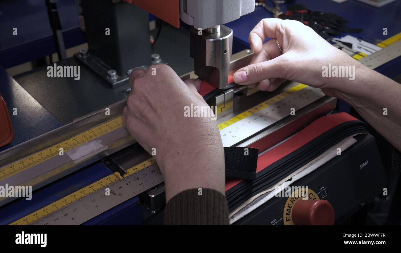 Industrial garment factory, an automatic sewing machine sews various ...