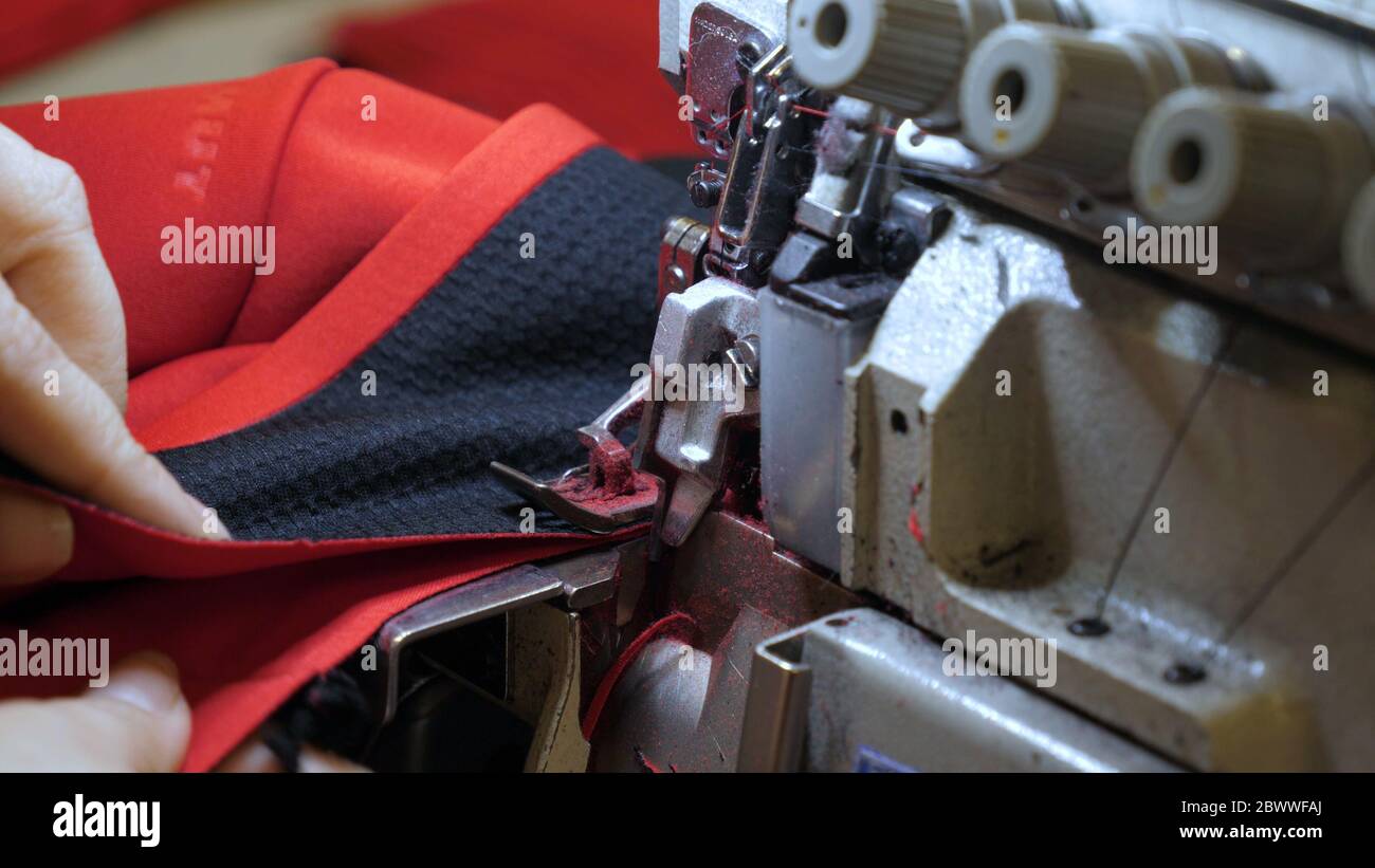 Industrial garment factory, an automatic sewing machine sews various ...