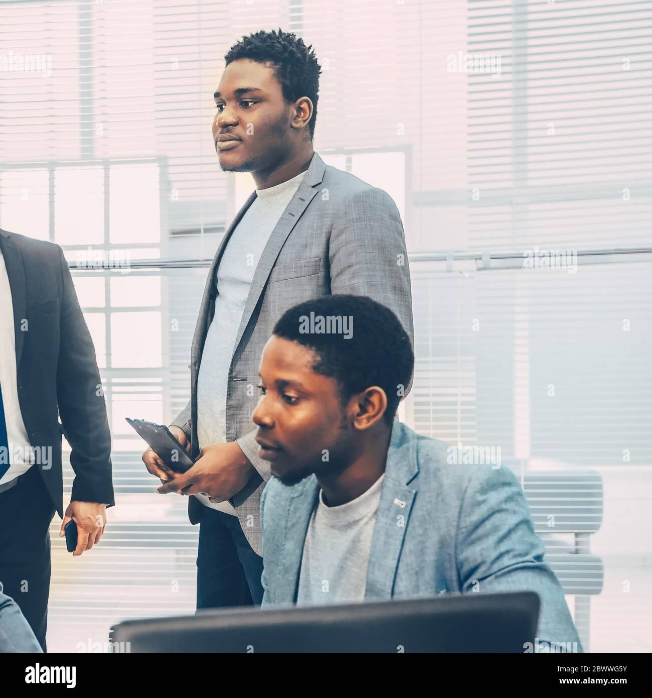 multinational business team works in the office Stock Photo - Alamy