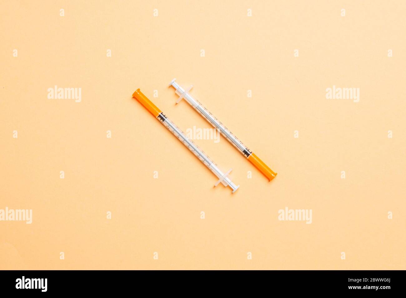 Top view of insulin syringes ready for injection on colorful background ...