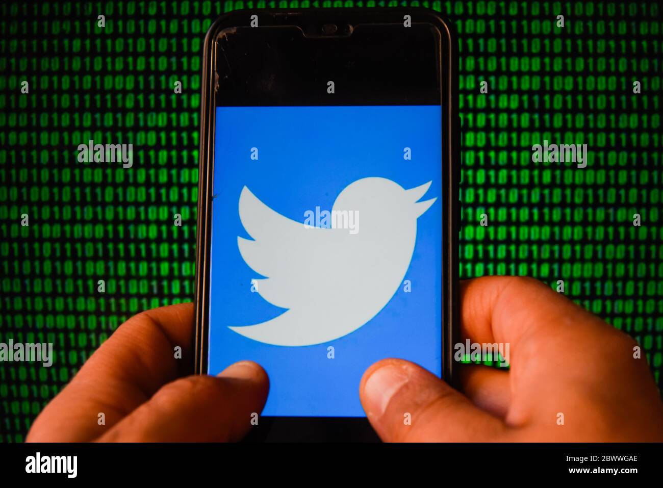 In this photo illustration a Twitter logo is seen displayed on a ...