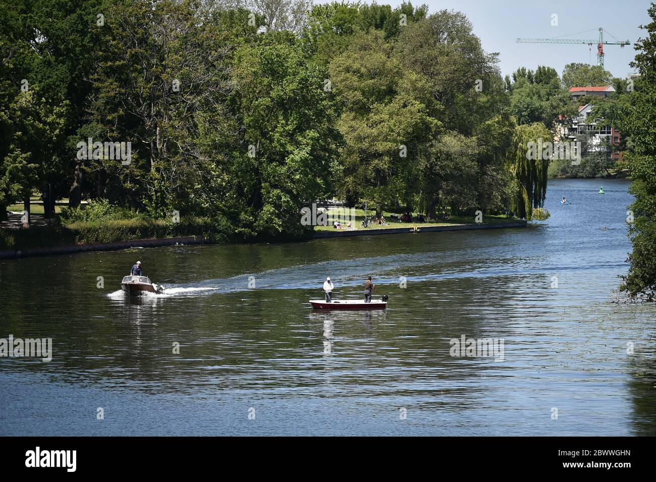 Berlin, Germany. 03rd June, 2020. Two people are fishing on a boat on ...