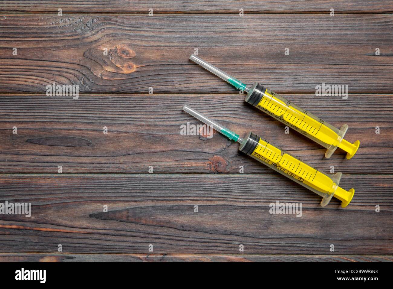 Top view of syringes on wooden background with copy space. Medical ...