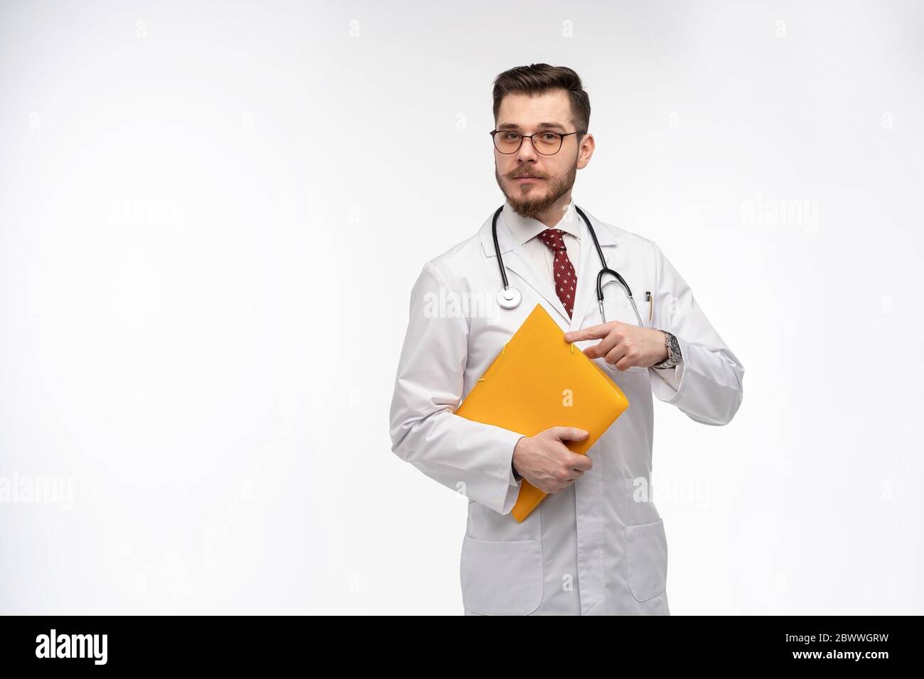 A portrait of a medical doctor posing against white background Stock ...