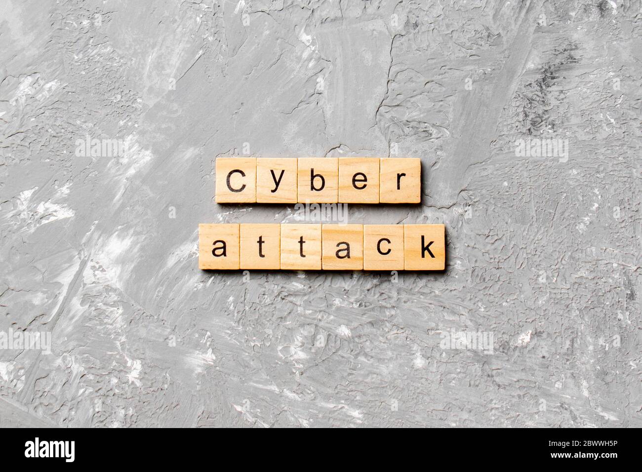 Cyber attack word written on wood block. Cyber attack text on cement ... Cyber attack word written on wood block. Cyber attack text on cement ...