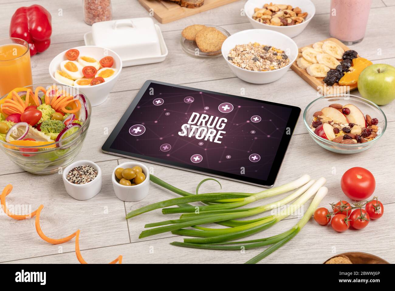 DRUG STORE concept in tablet pc with healthy food around, top view ...