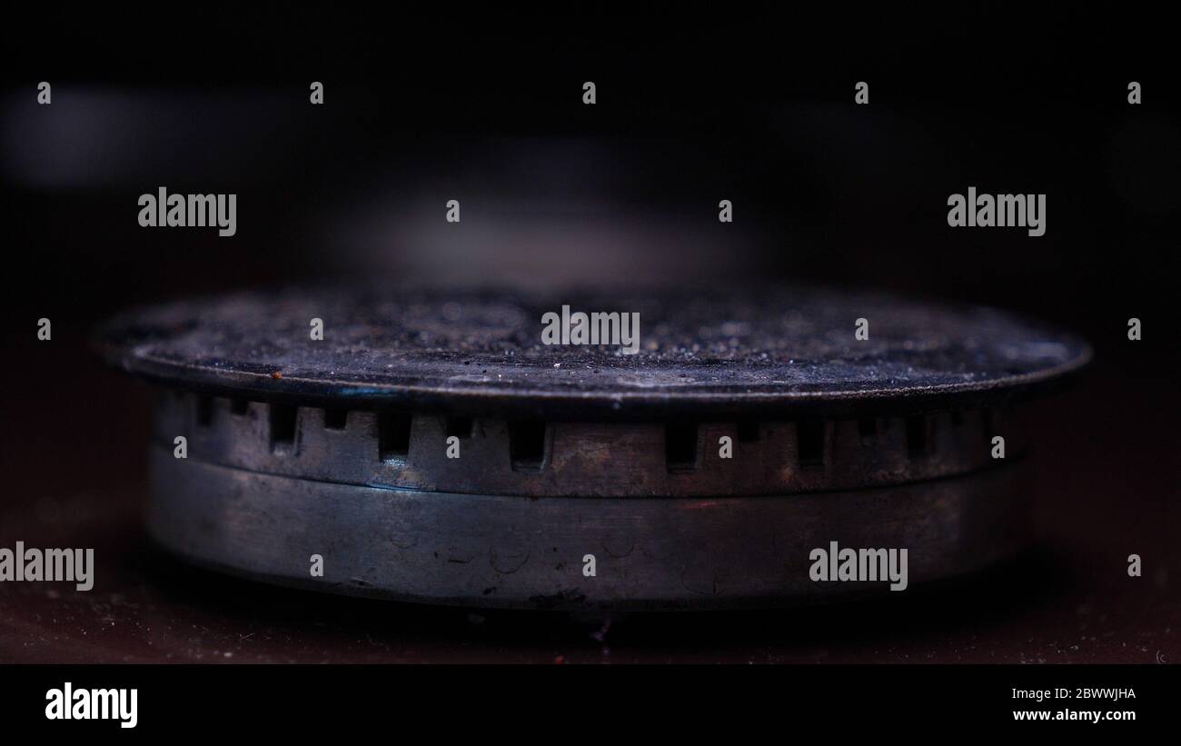 Very closely displayed as the gas stove is lit, checking on and off ...